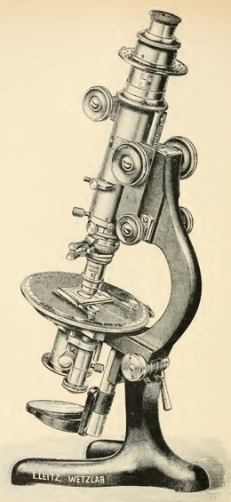 A close-up of a microscopeDescription automatically generated with ...