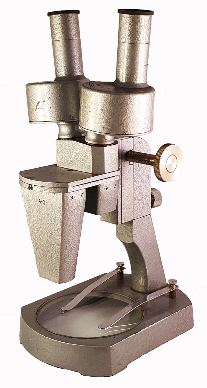 A close-up of a microscopeDescription automatically generated with ...