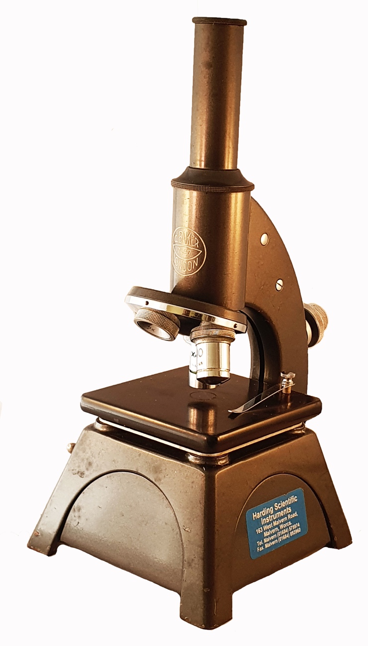 A close-up of a microscopeDescription automatically generated